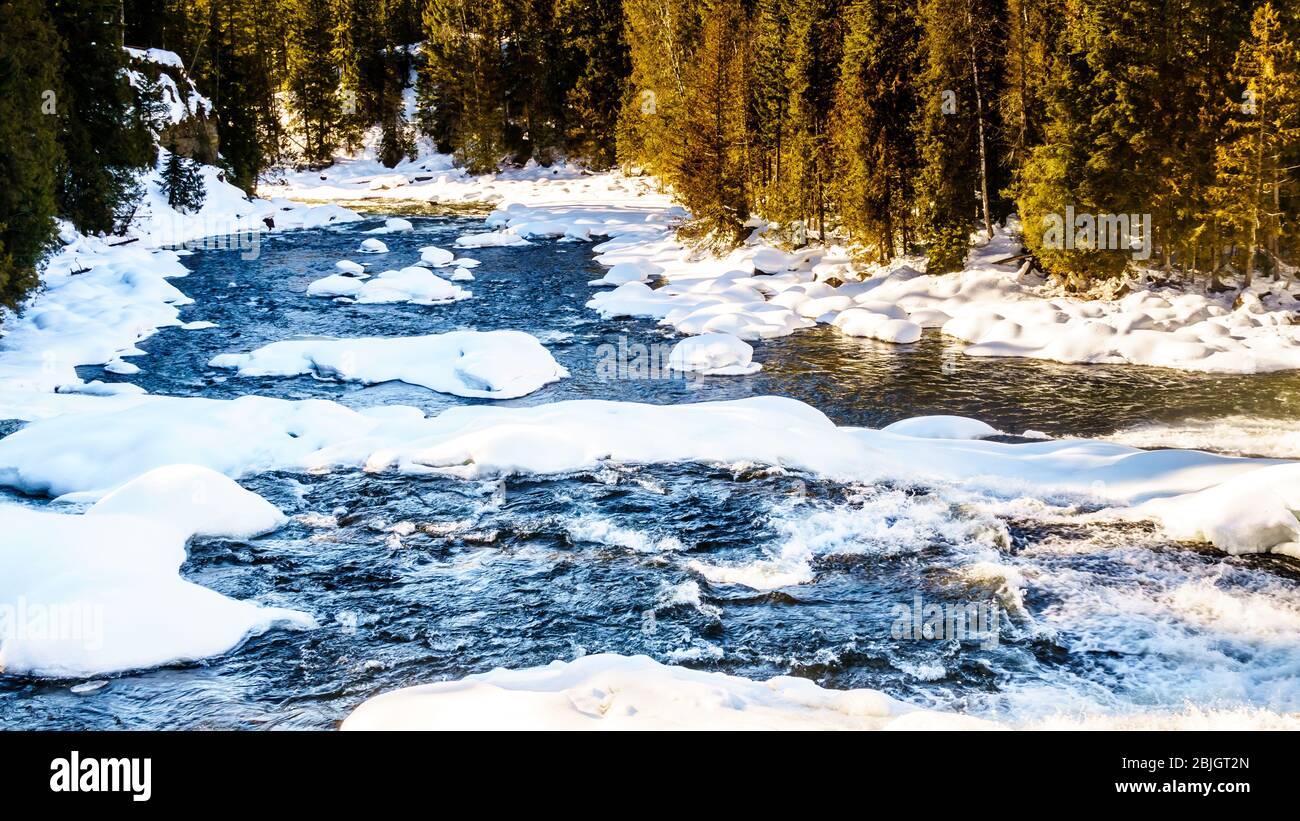 The partly frozen Murtle River right after Dawson Falls in the Cariboo ...