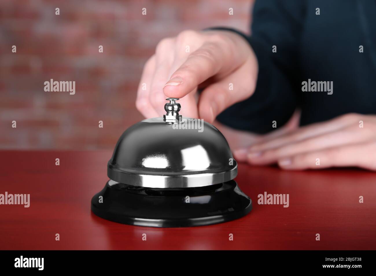 Woman ringing hotel reception bell hi-res stock photography and images ...