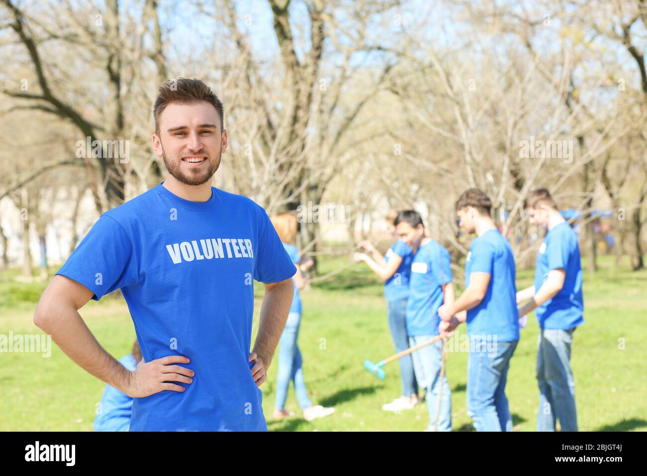 Handsome young volunteer team hi-res stock photography and images - Alamy