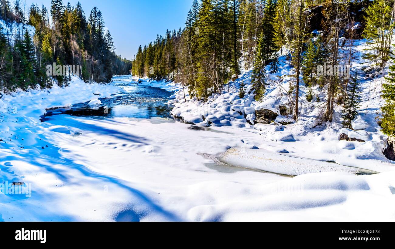 The partly frozen Murtle River after Mushbowl Falls in the Cariboo ...