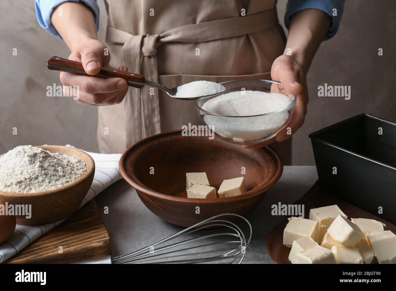 Woman making dough for a pie in bowl Stock Photo - Alamy