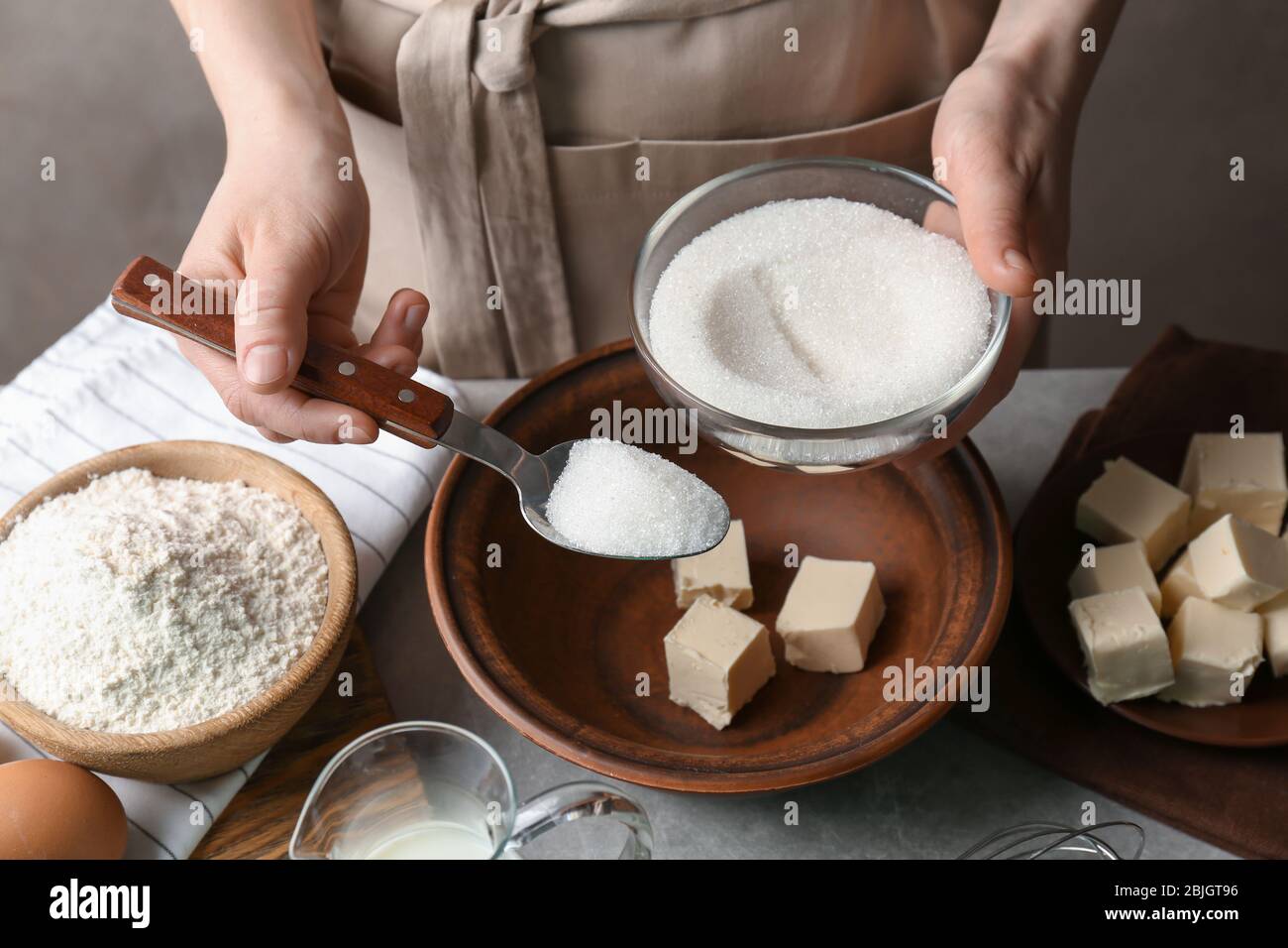 Woman making dough for a pie in bowl Stock Photo - Alamy
