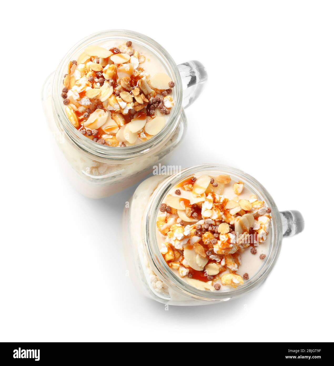 Delicious parfait with granola in jar on white background Stock Photo ...