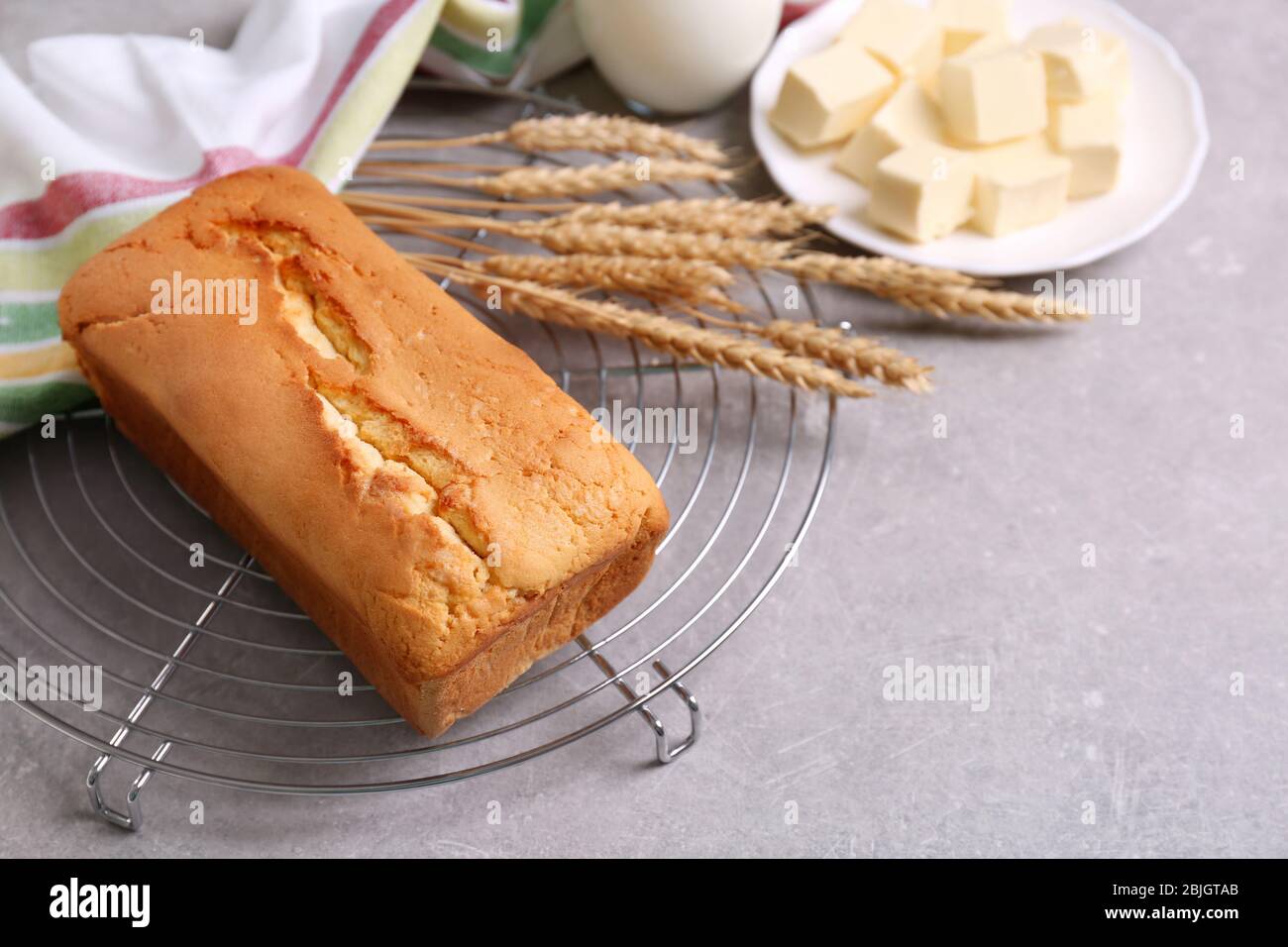 Baked butter cake with ingredients on table Stock Photo - Alamy