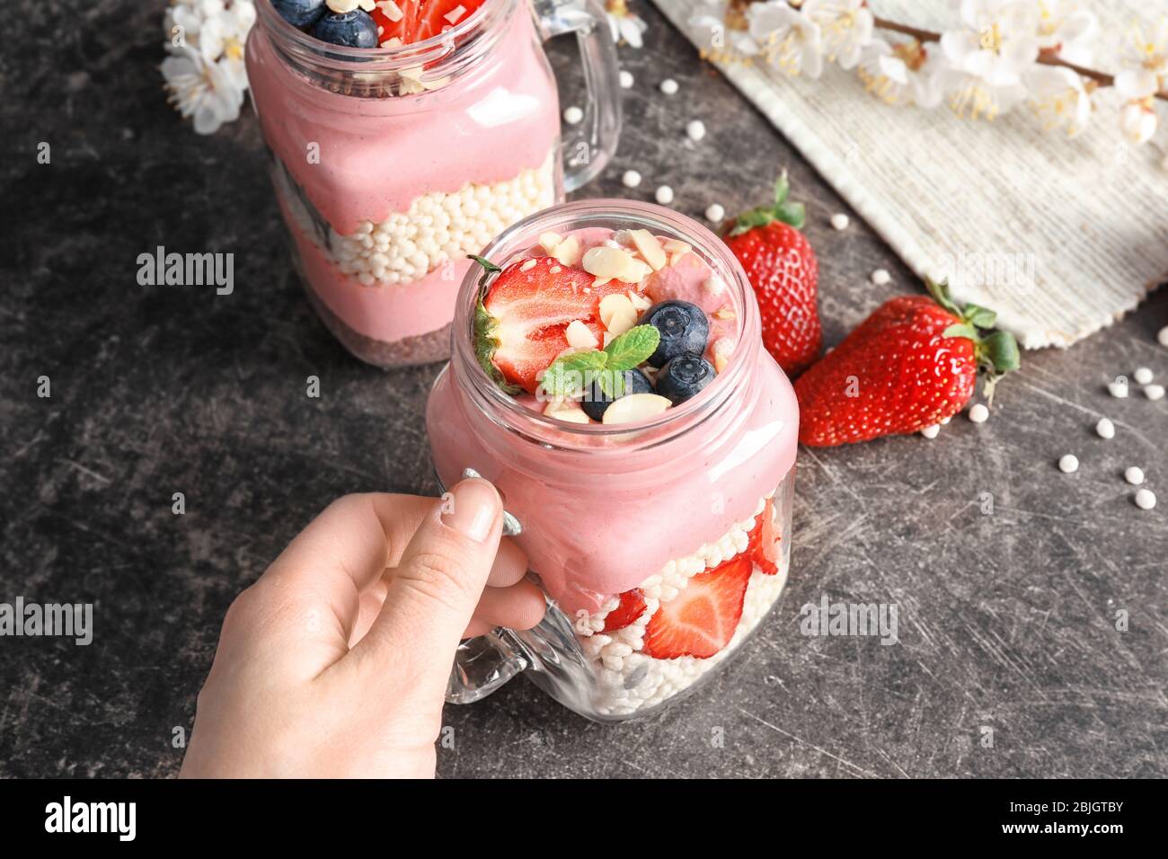 Woman and yogurt parfait hi-res stock photography and images - Alamy
