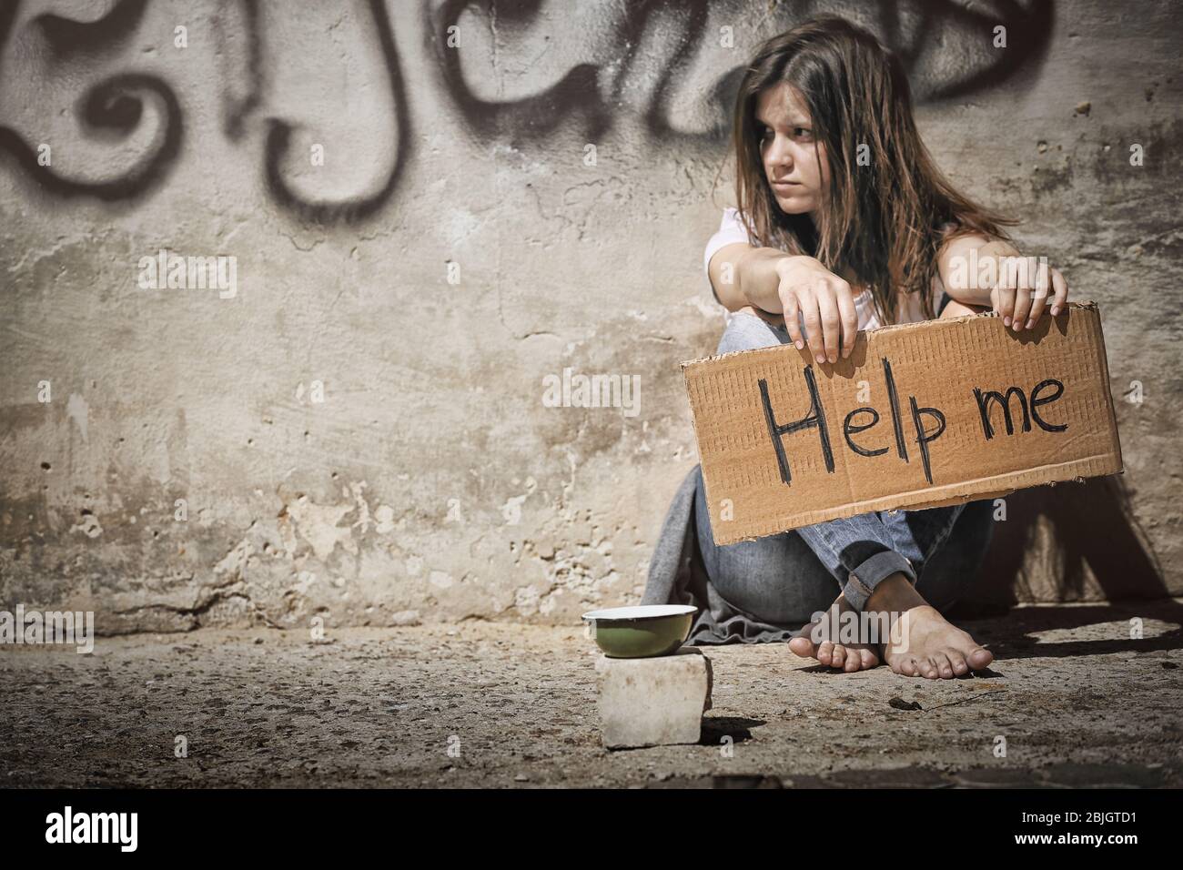 Poor woman begging for help on the street Stock Photo - Alamy