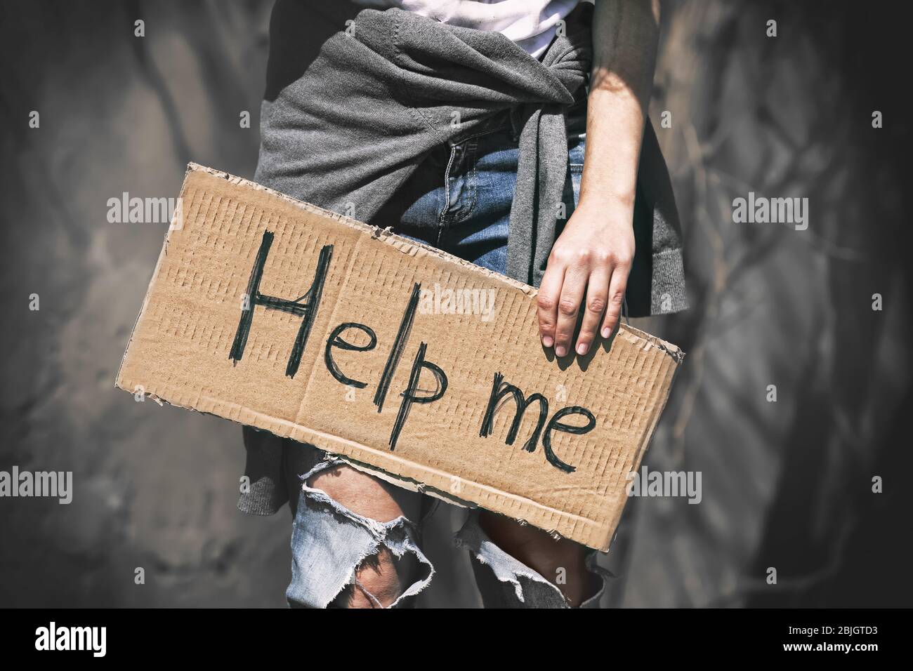 Poor woman begging for help on the street Stock Photo - Alamy