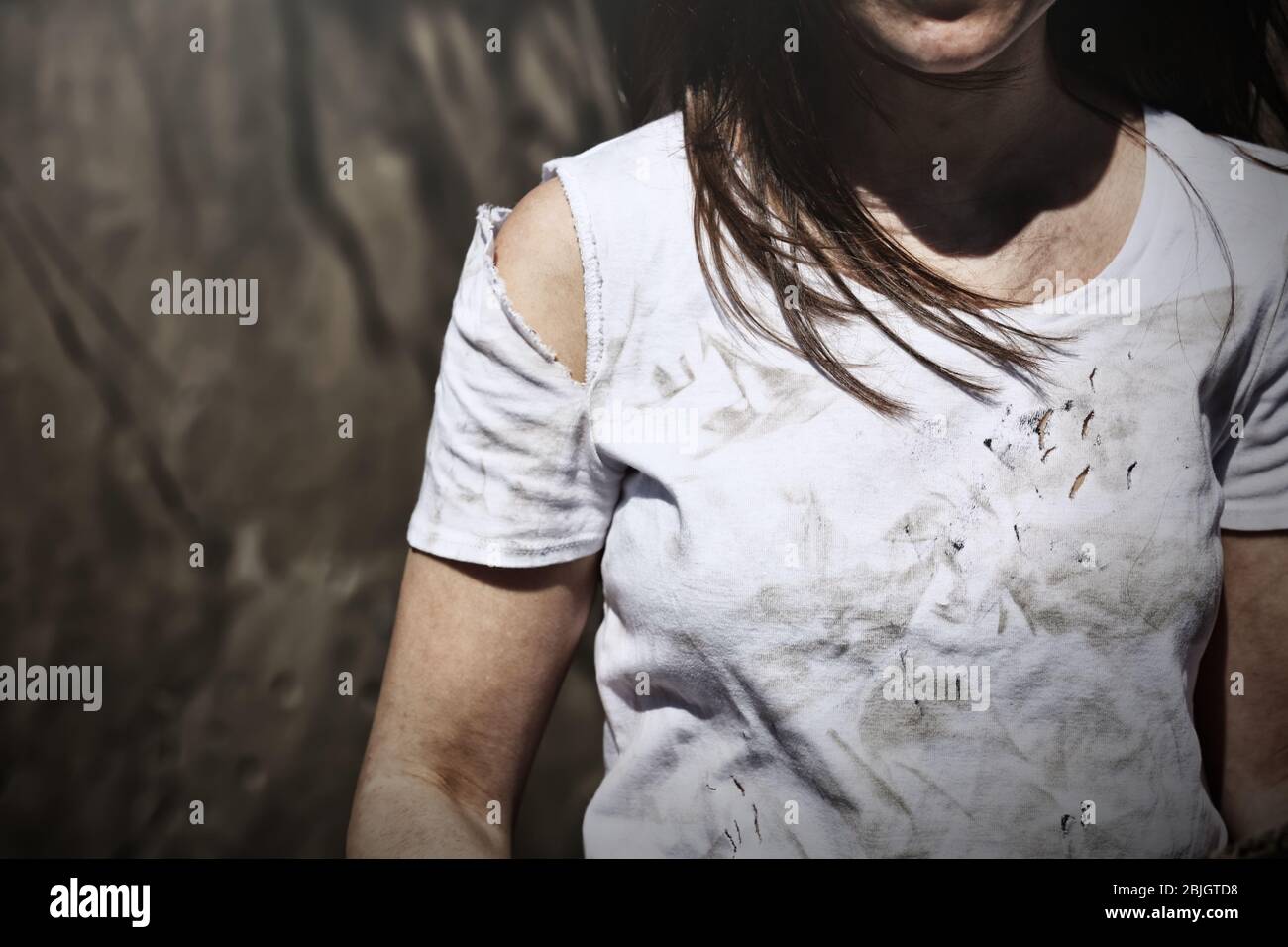 Poor woman in dirty clothes outdoors Stock Photo - Alamy