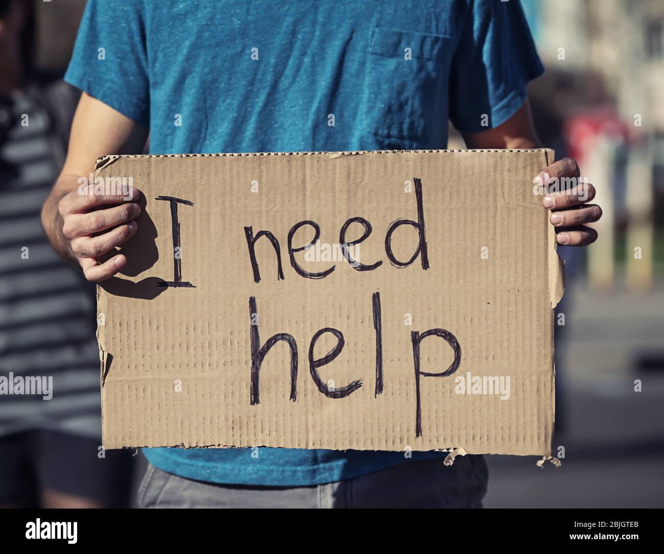 Man begging for help on the street Stock Photo - Alamy