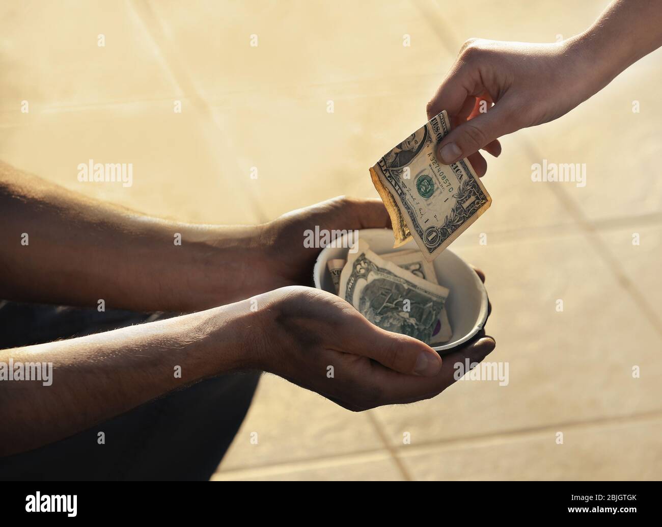 Poor man begging for money on the street Stock Photo - Alamy