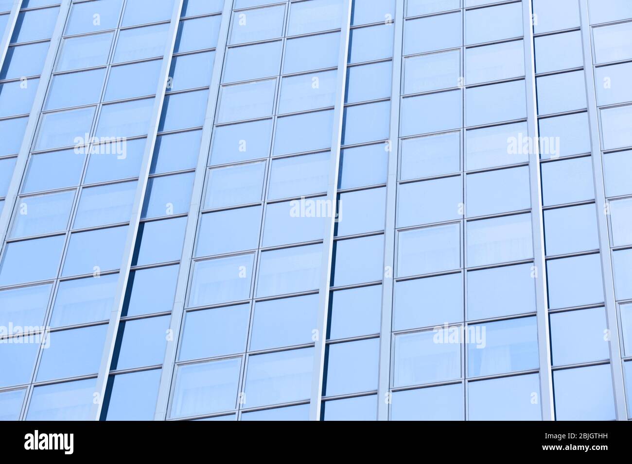 Building with tinted windows as background Stock Photo - Alamy