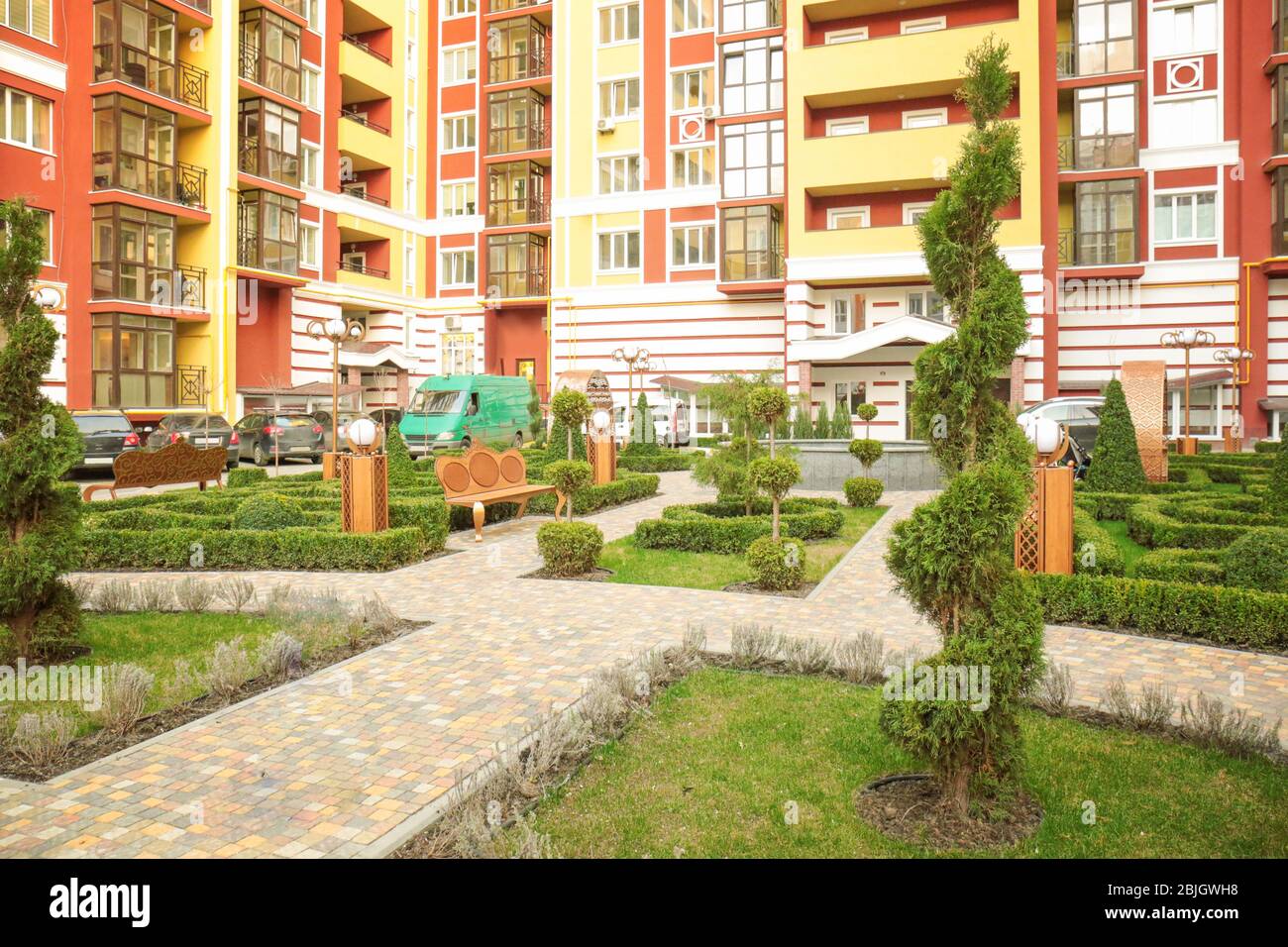 Exterior view of tower block building and yard Stock Photo - Alamy