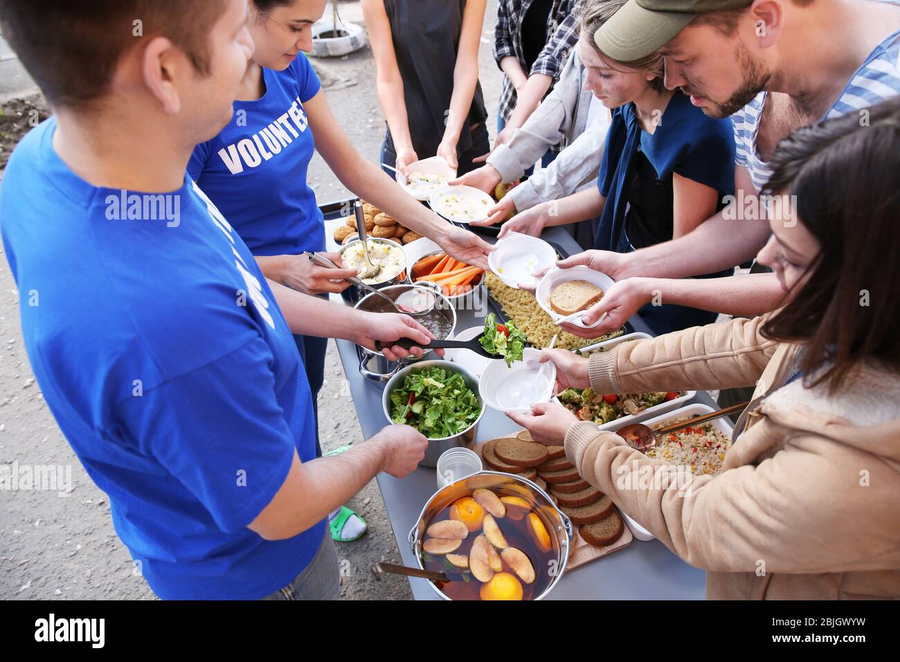 Children Sharing Food To The Poor