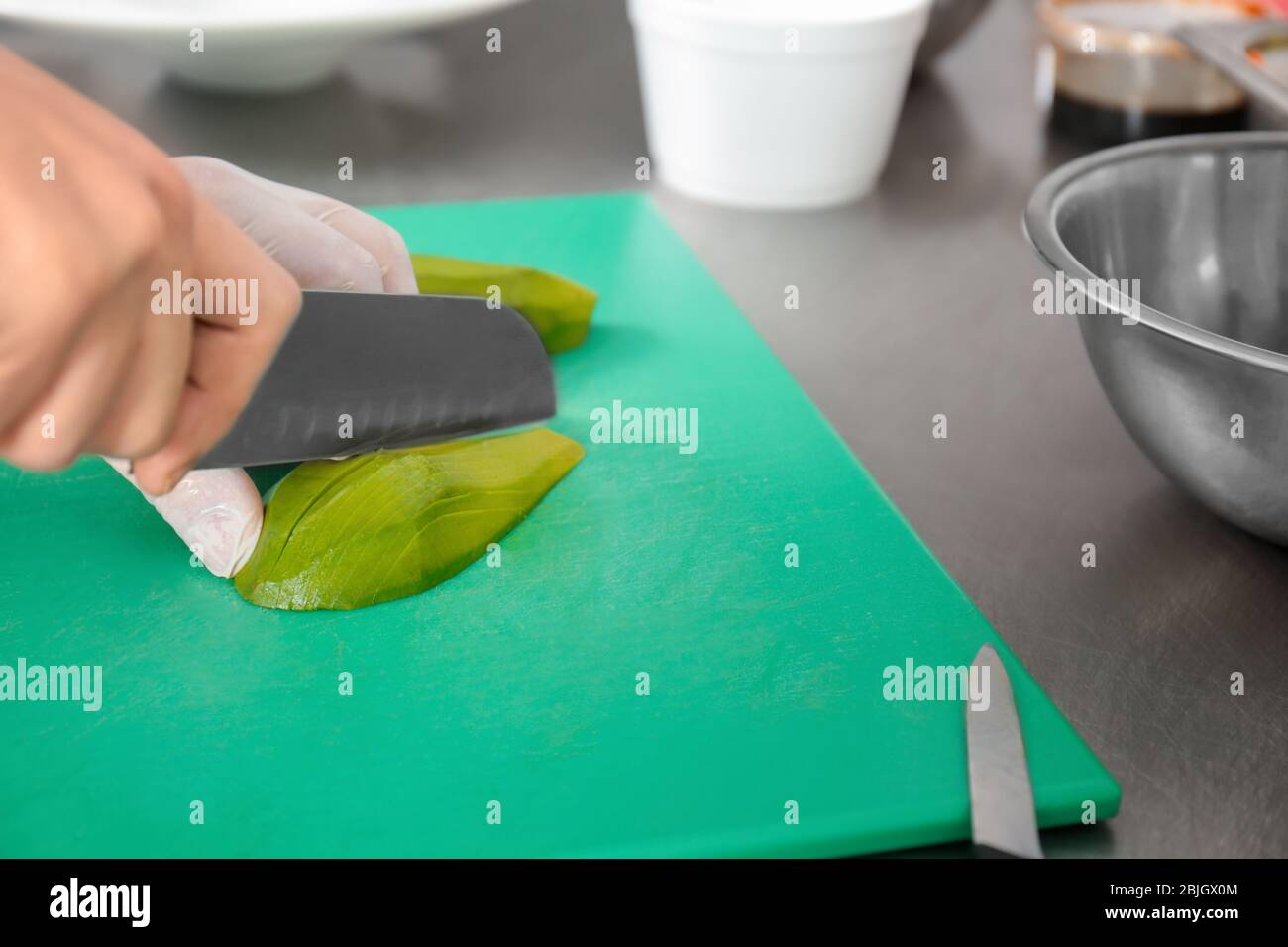 Professional chef hands cutting avocado hi-res stock photography and ...