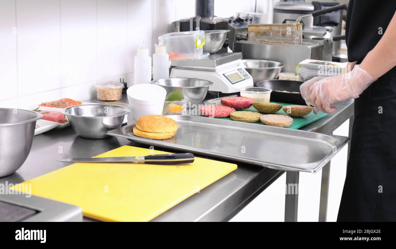 Female chef preparing delicious sandwiches in kitchen Stock Photo - Alamy