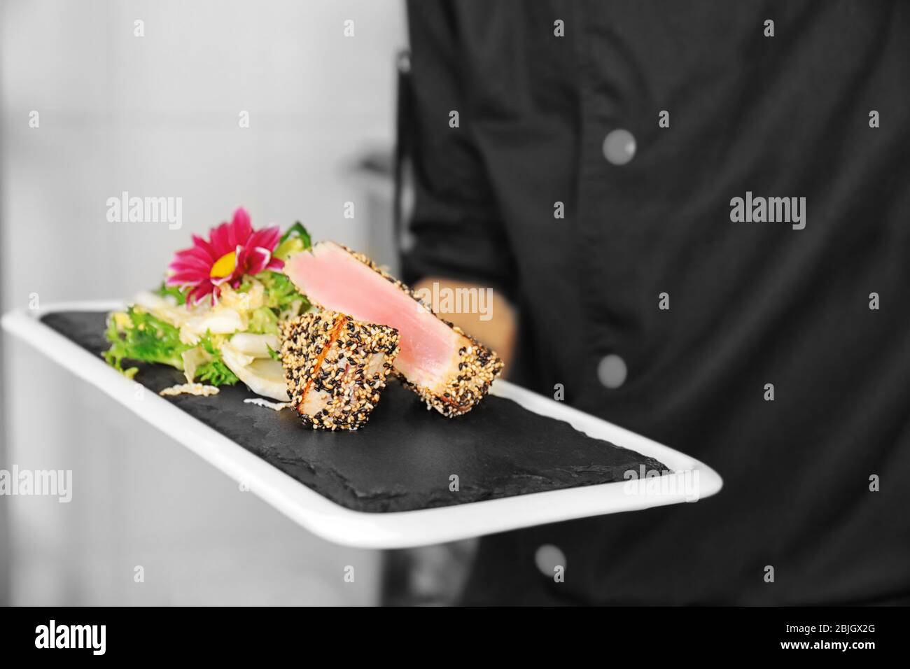 Female chef holding tray with delicious tuna fillet, closeup Stock ...