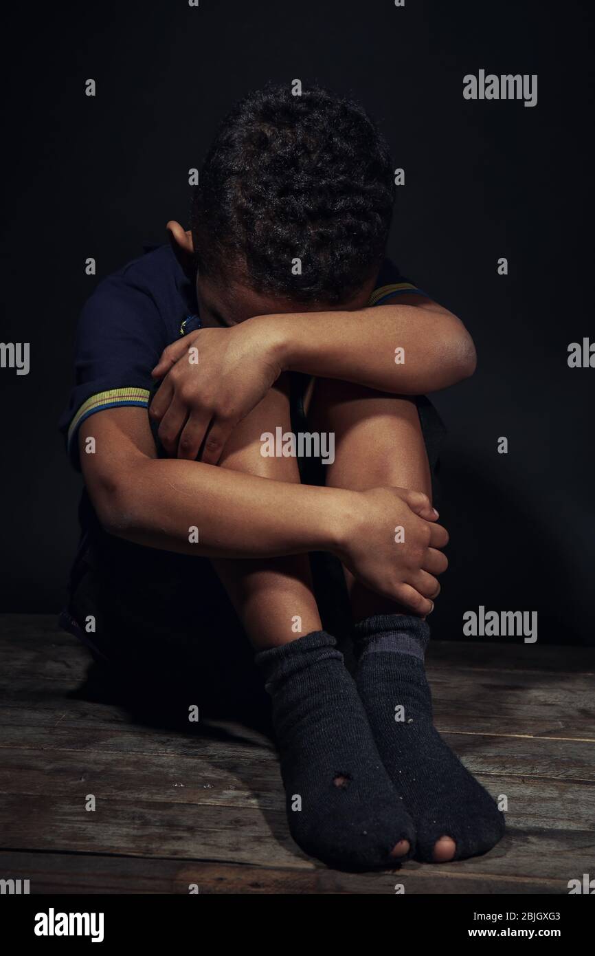 Cute homeless child sitting in hi-res stock photography and images - Alamy