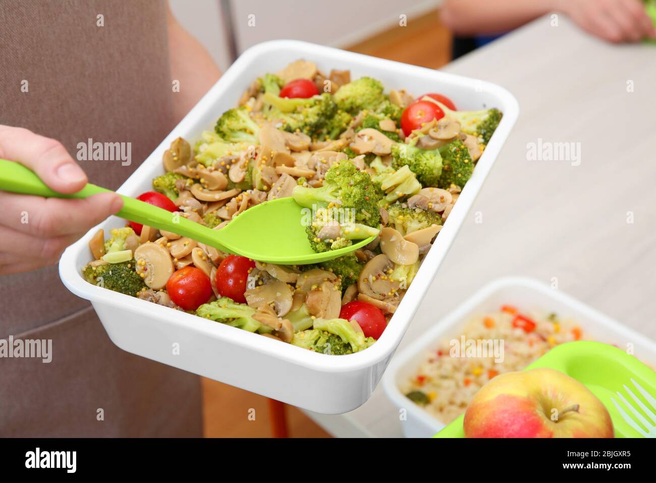 Woman serving lunch hi-res stock photography and images - Alamy