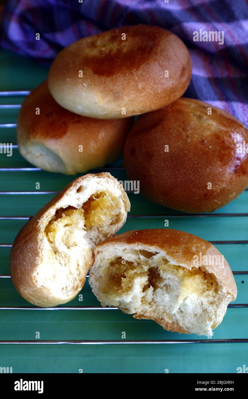 Photo of freshly baked Filipino bread called Pan de Coco or bread roll ...
