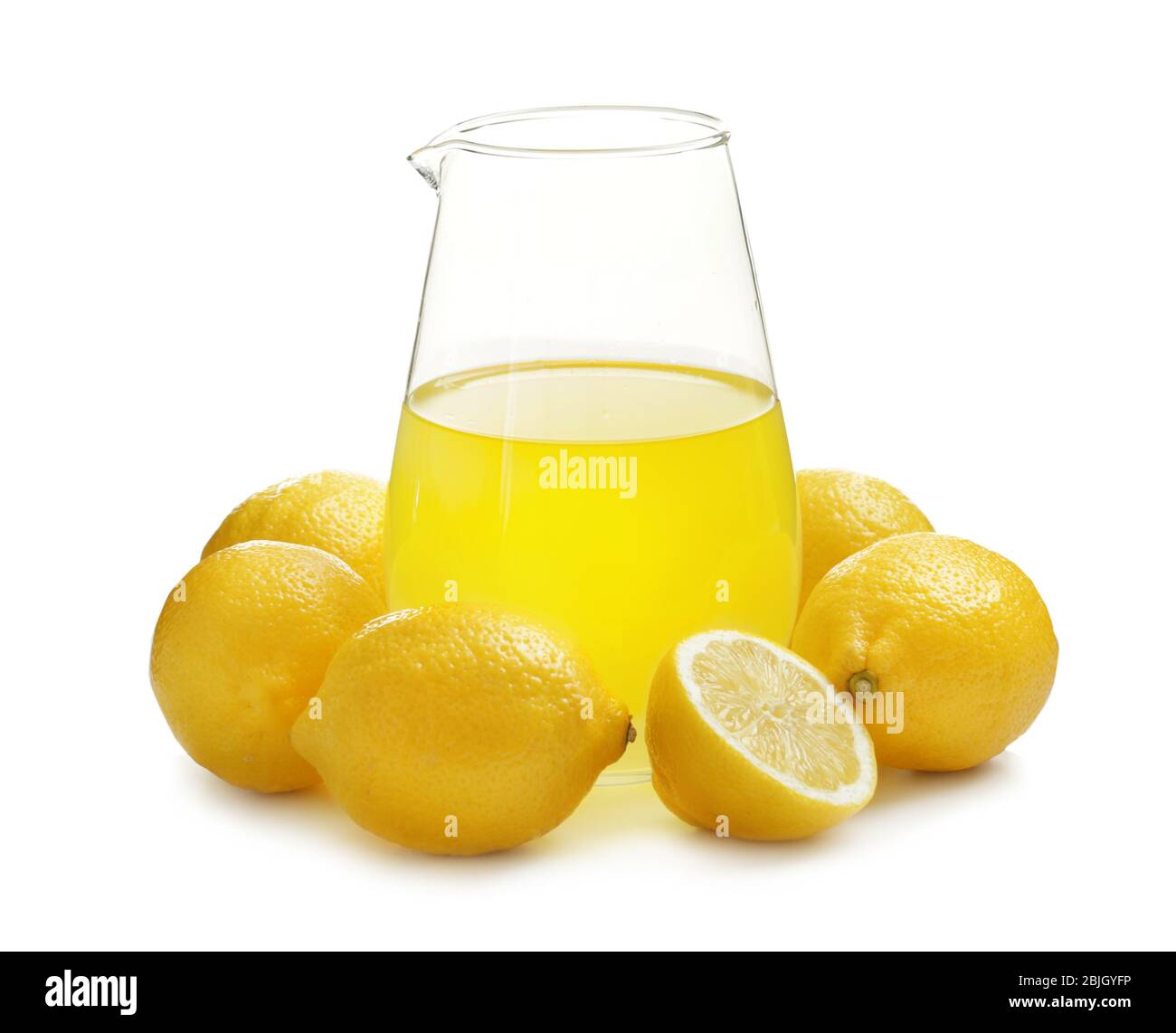 Delicious lemon juice in pitcher on white background Stock Photo - Alamy