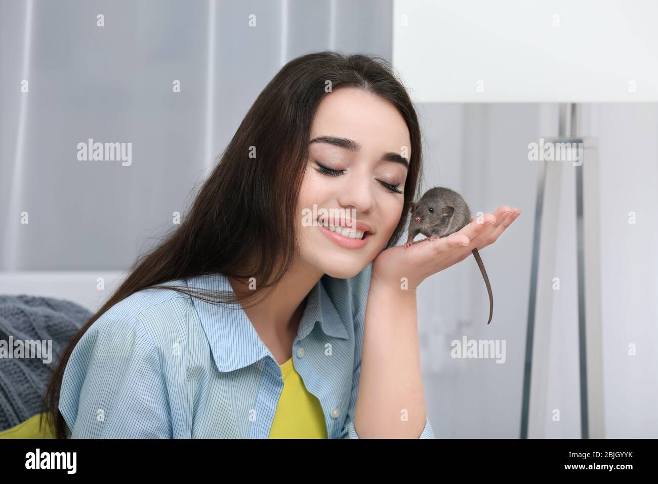 Young woman with funny rat at home Stock Photo - Alamy