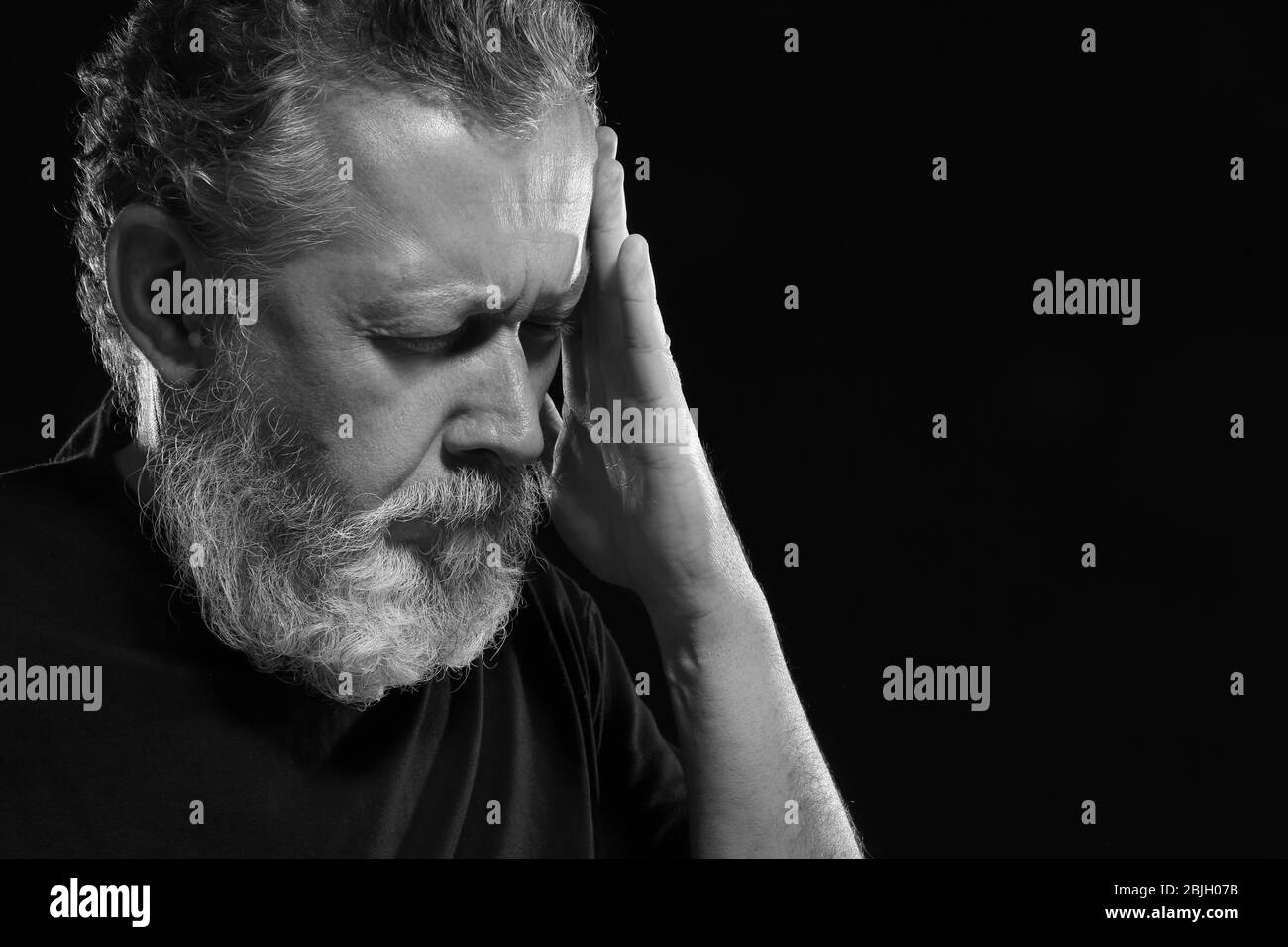 Handsome elderly man on black background Stock Photo - Alamy