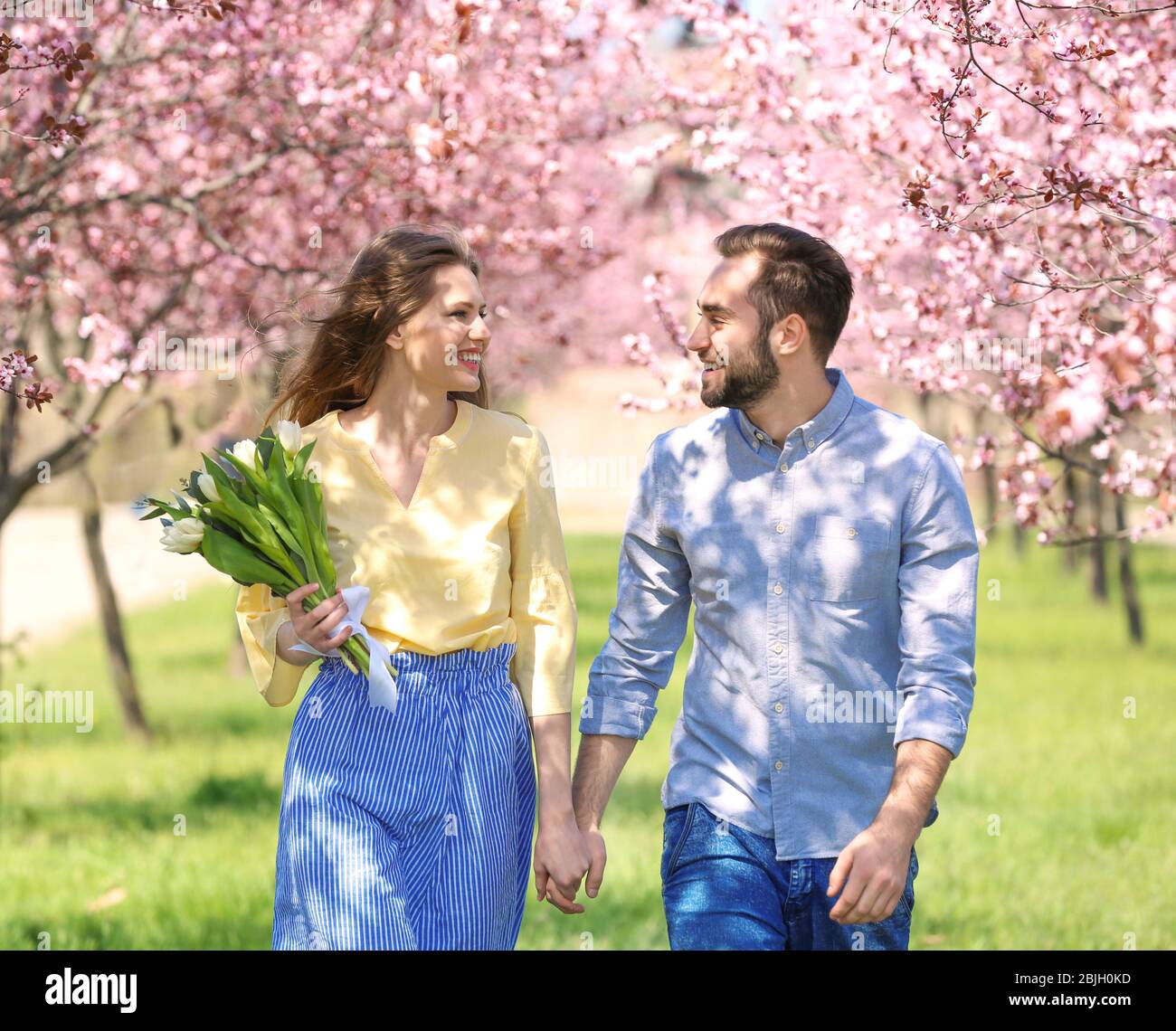 Lovely young couple walking hi-res stock photography and images - Alamy
