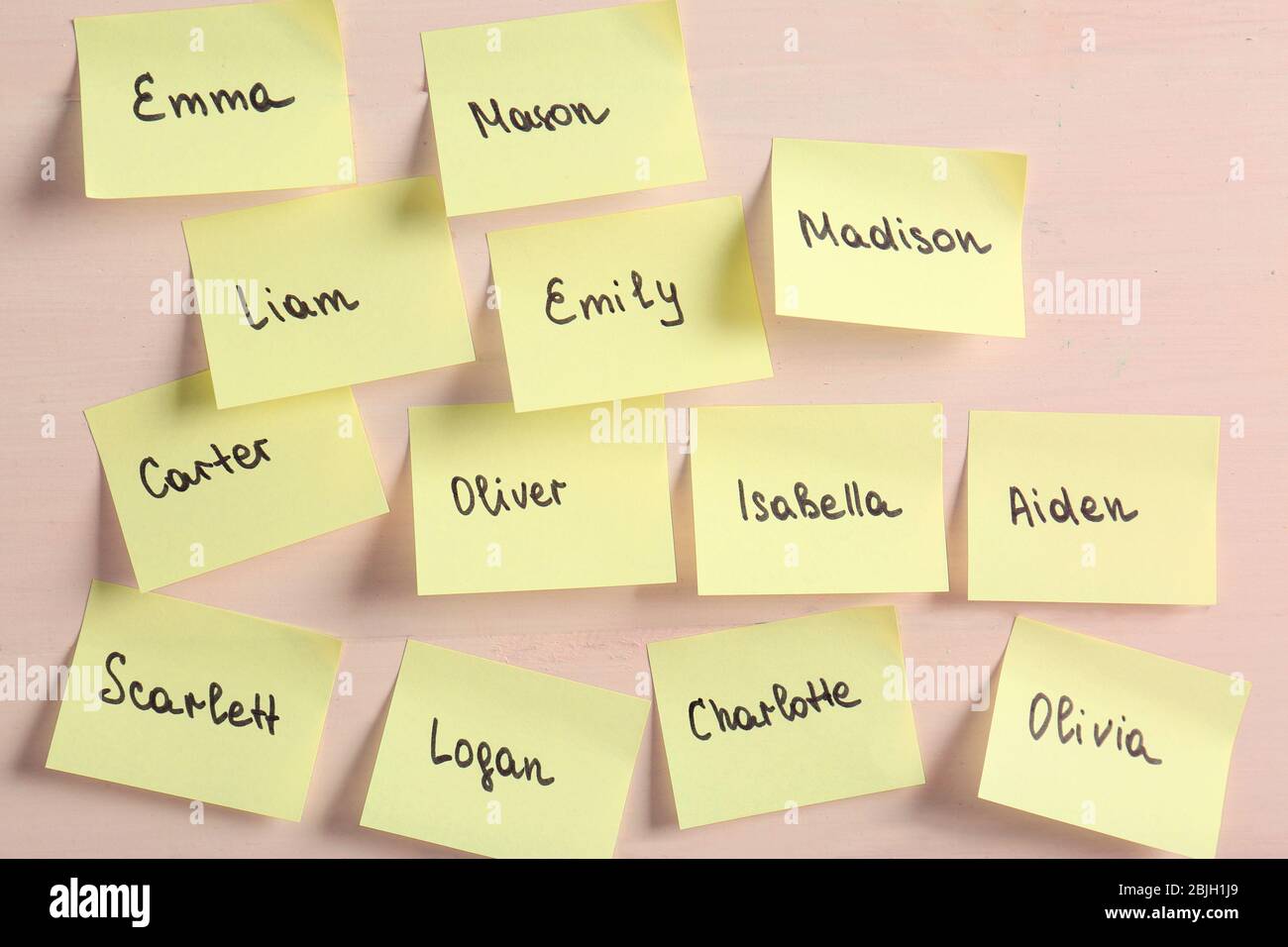 Paper stickers with different names on wooden background Stock Photo ...