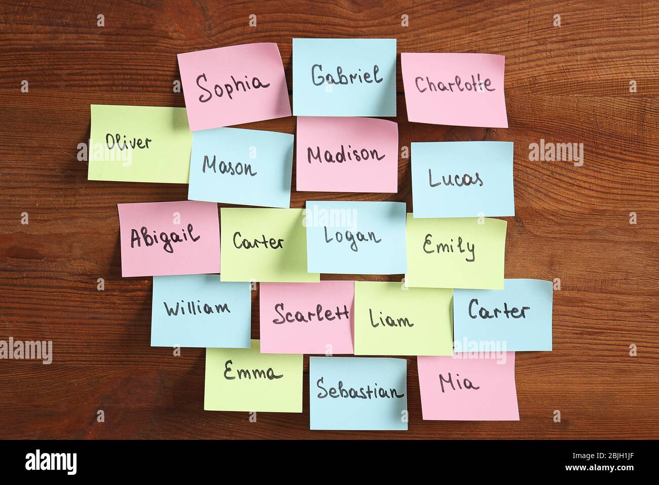 Paper stickers with different names on wooden background Stock Photo ...