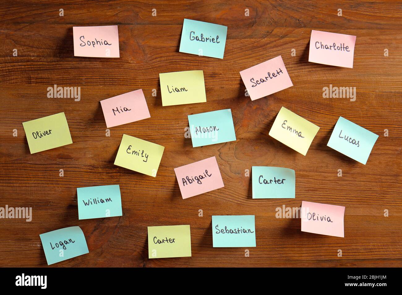 Paper stickers with different names on wooden background Stock Photo ...