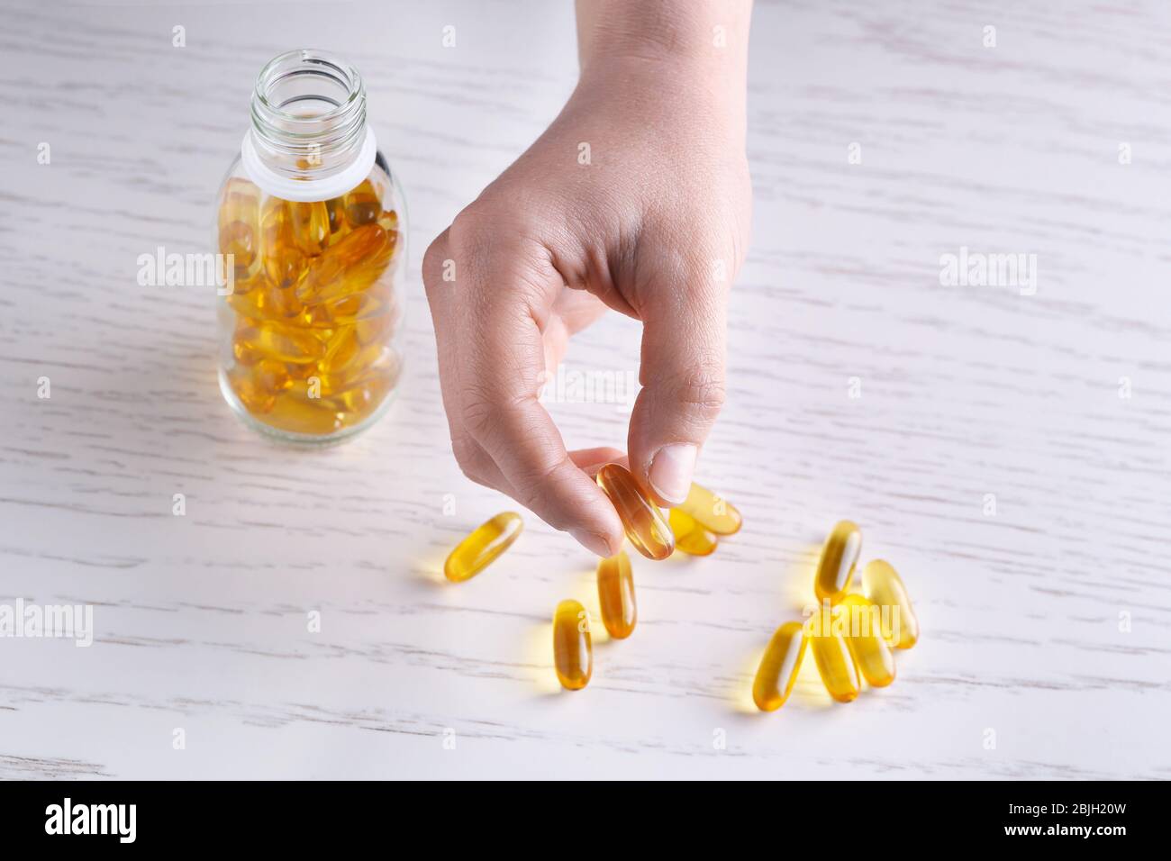 Hand holding golden fish in hi-res stock photography and images - Alamy