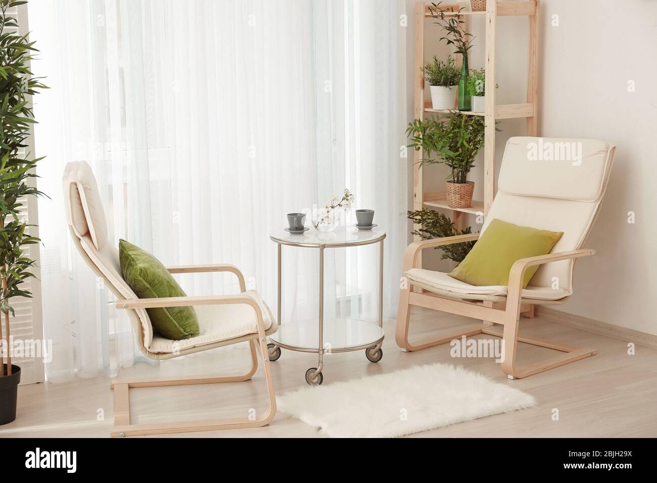 Beautiful modern veranda with cozy armchairs and coffee table Stock ...