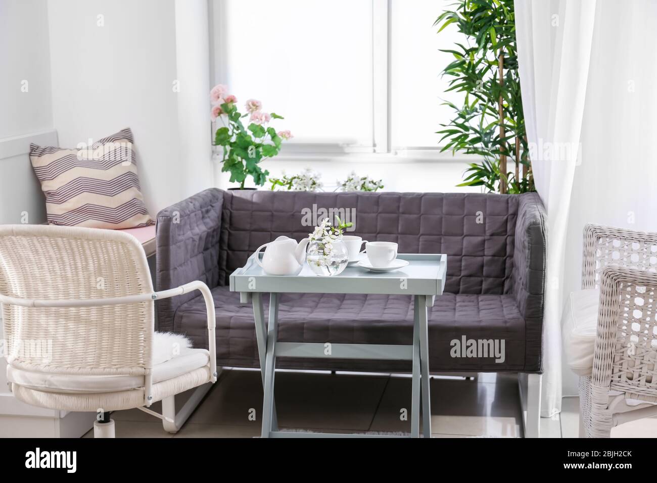 Beautiful modern veranda with cozy furniture Stock Photo - Alamy