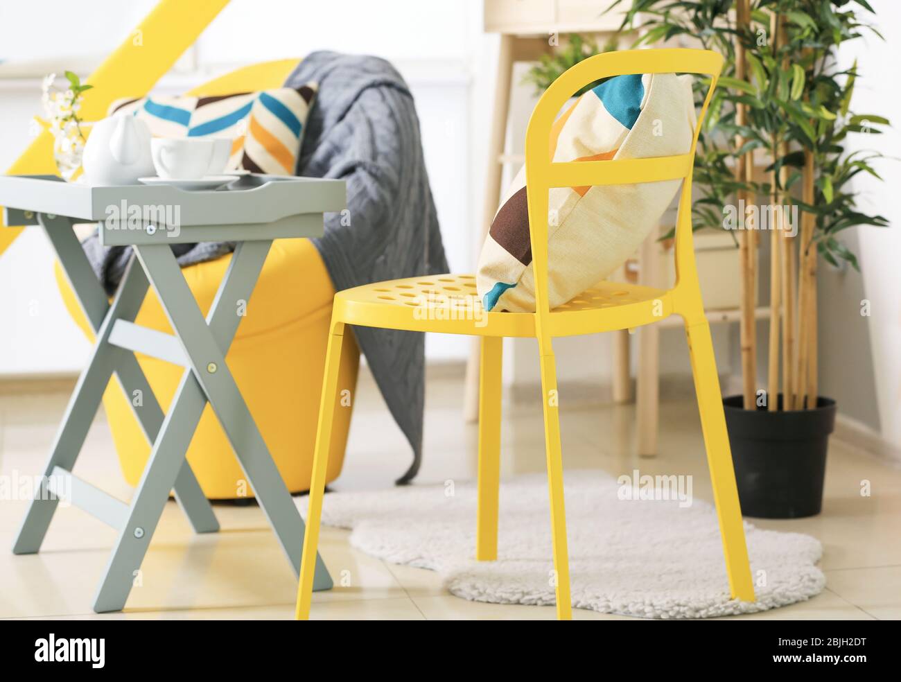 Cozy chair and coffee table in beautiful veranda interior Stock Photo ...