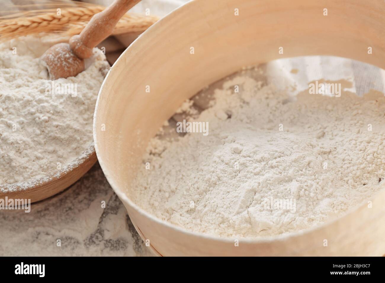 Big sieve with flour, close up Stock Photo - Alamy