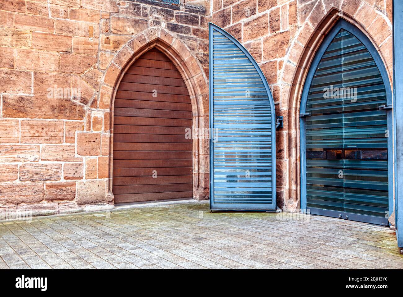 entrance with doors in the shape of arches Stock Photo - Alamy