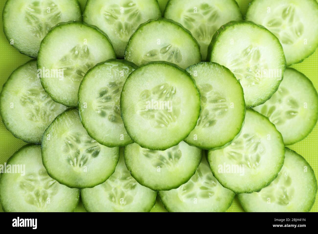 Fresh green slices of cucumber as background Stock Photo - Alamy
