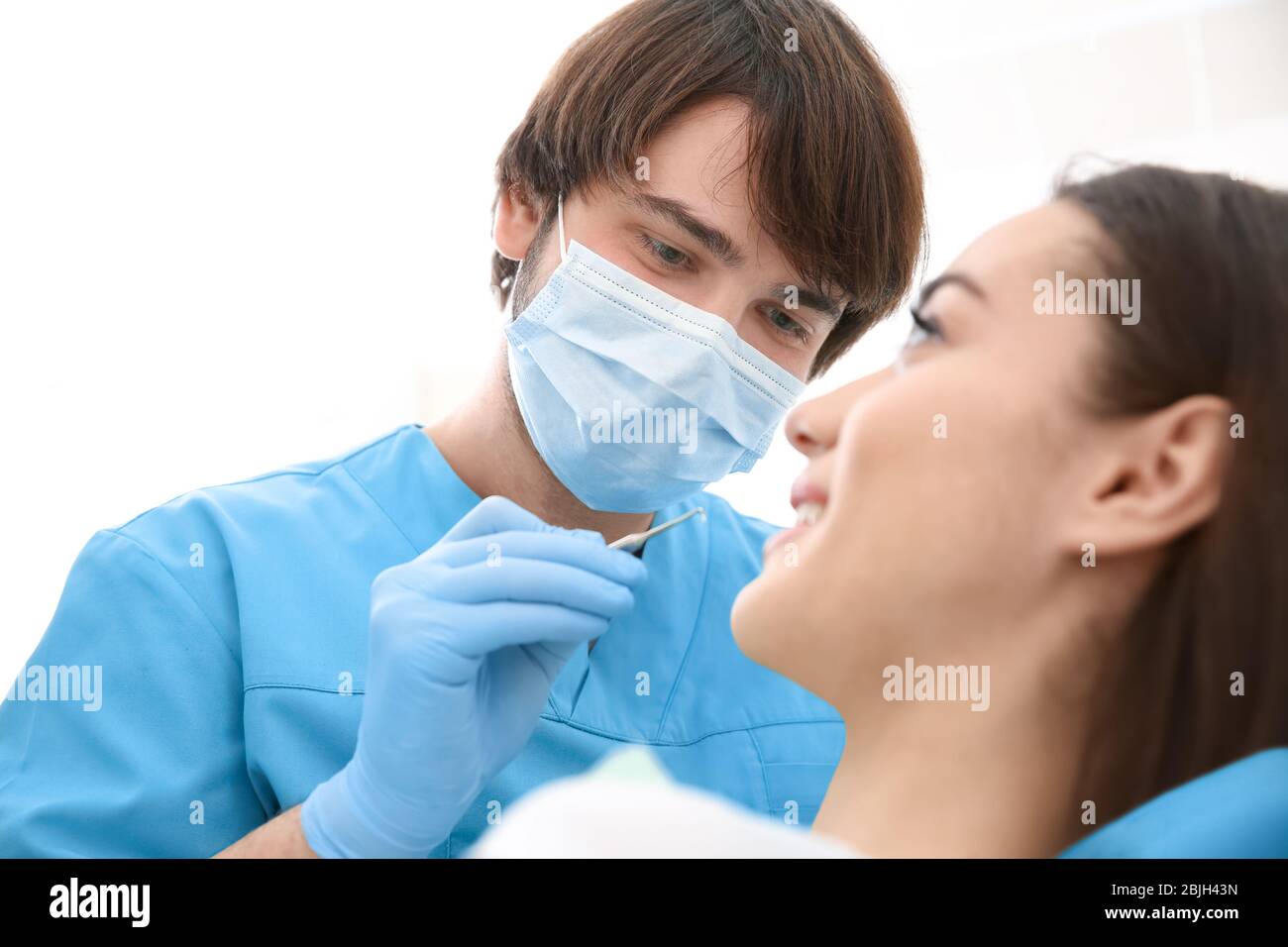 Dentist examining young womans teeth hi-res stock photography and images - Alamy