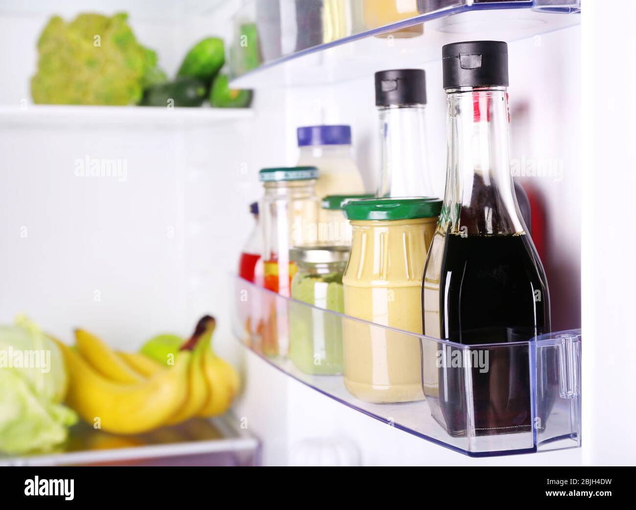 Many different sauces in fridge Stock Photo - Alamy