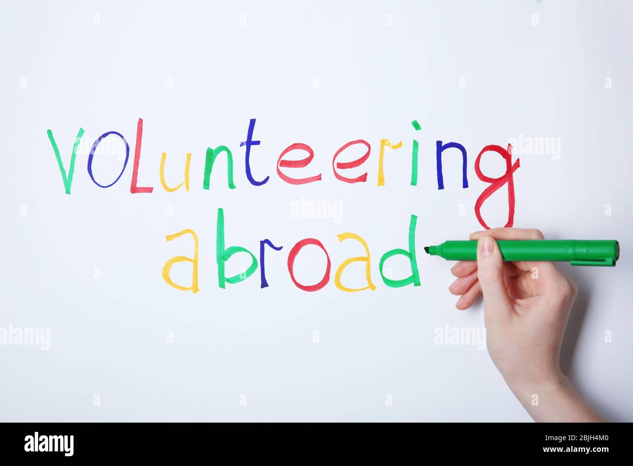 Woman writing text volunteering hi-res stock photography and images - Alamy
