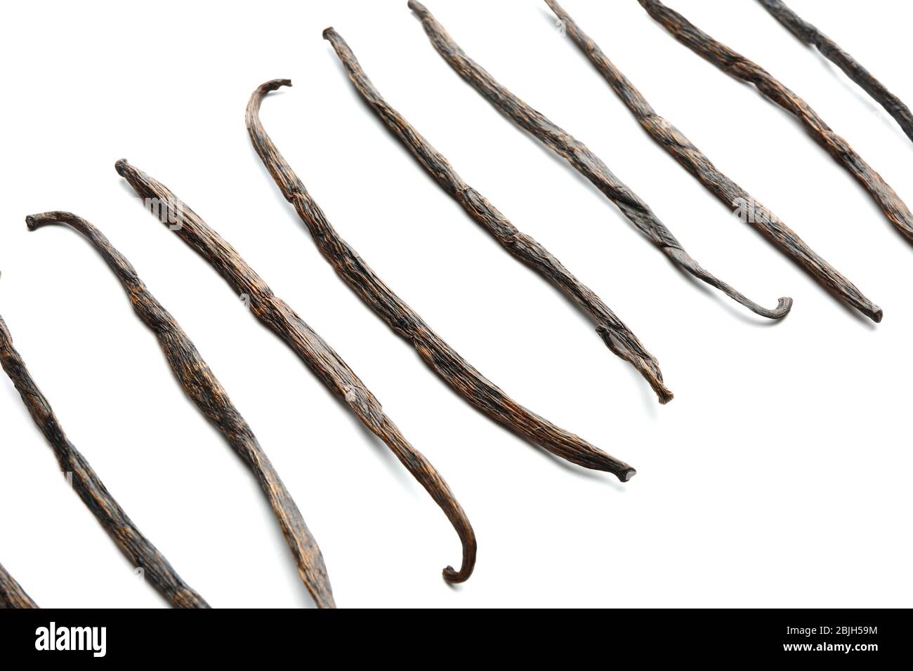 Vanilla pods on white background Stock Photo - Alamy
