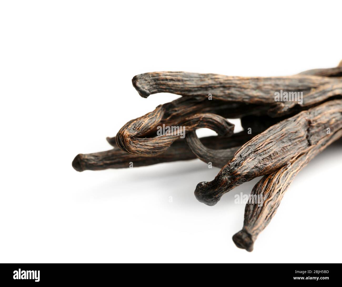 Vanilla pods on white background Stock Photo - Alamy