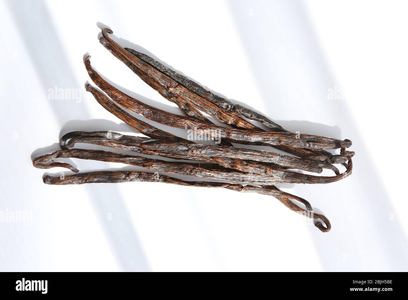 Vanilla pods on white background Stock Photo - Alamy
