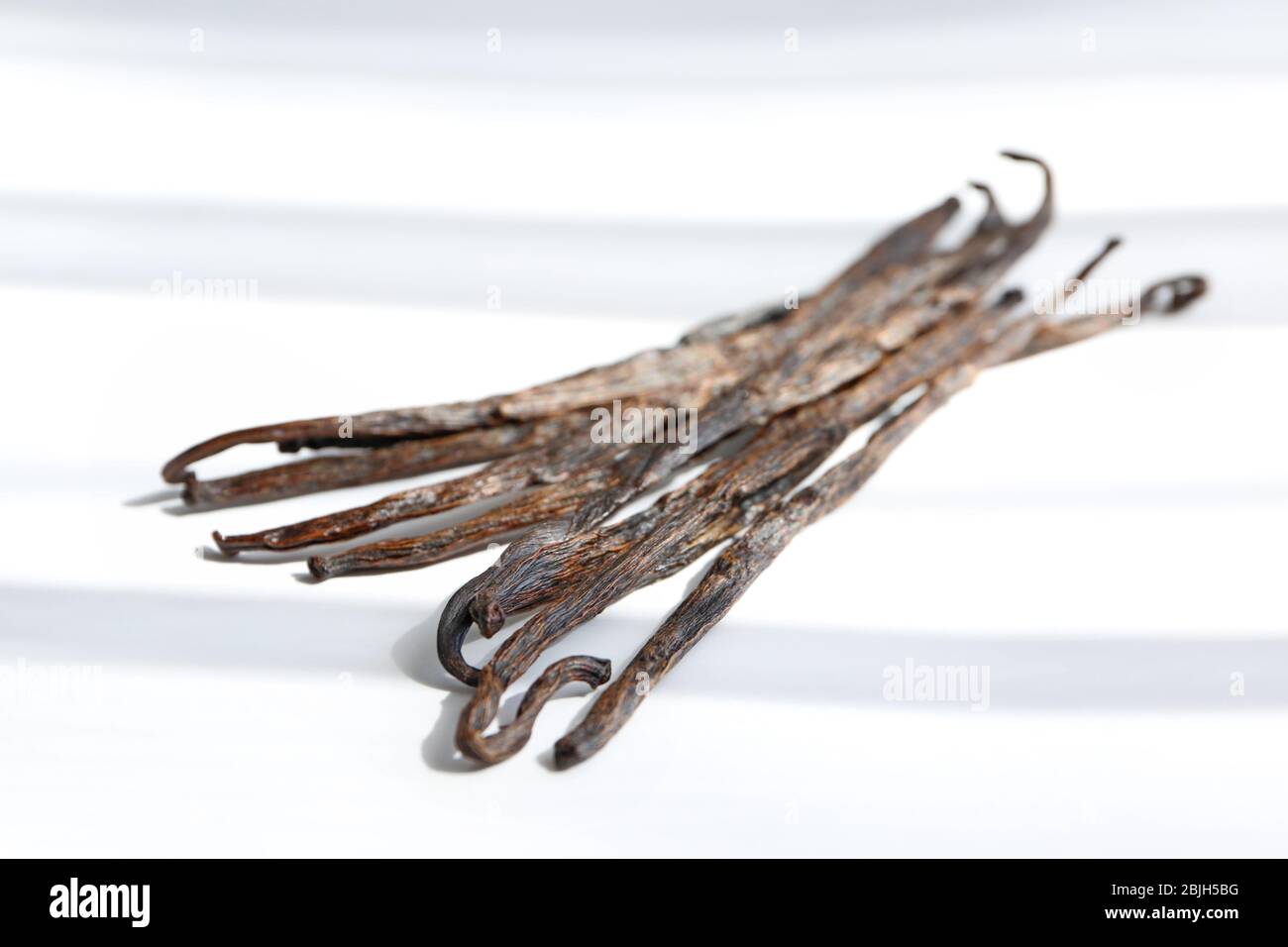 Vanilla pods on white background Stock Photo - Alamy