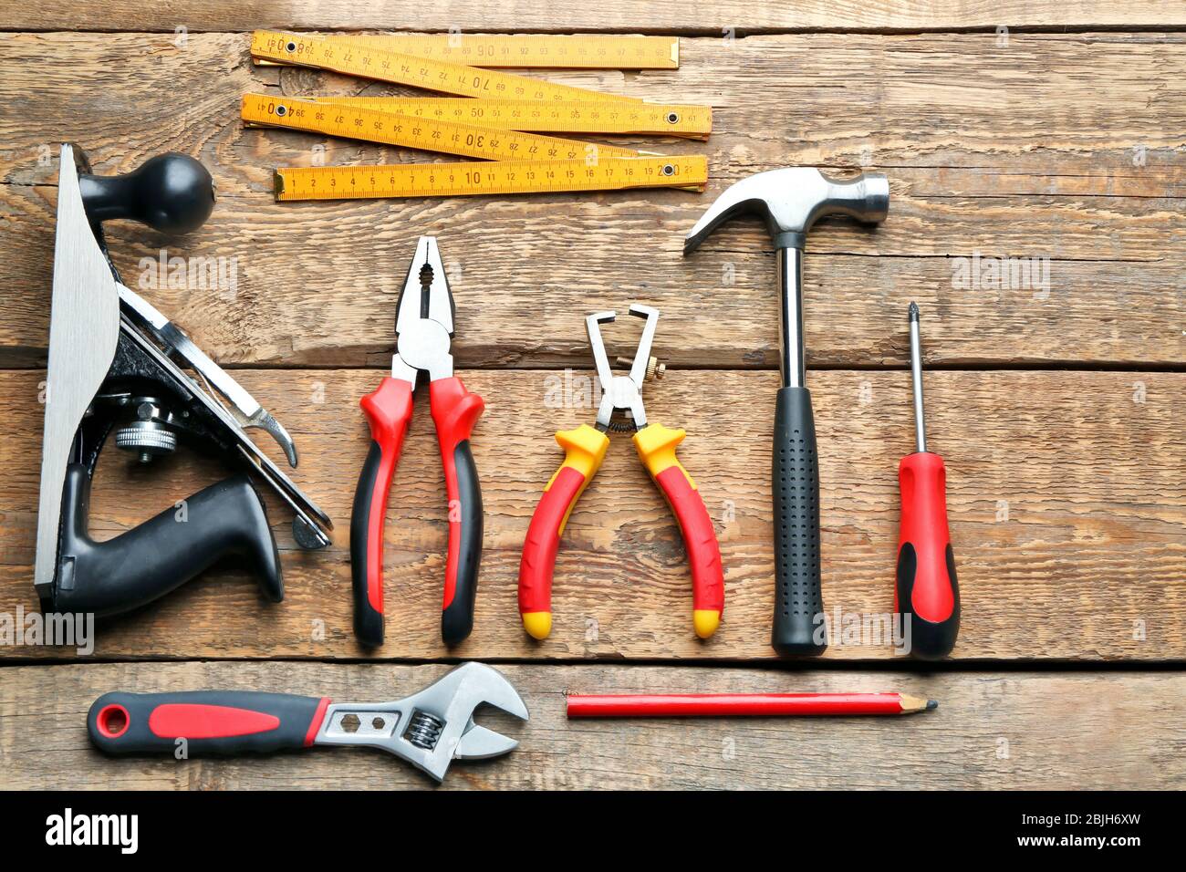 Set of carpenter's tools on wooden background Stock Photo - Alamy