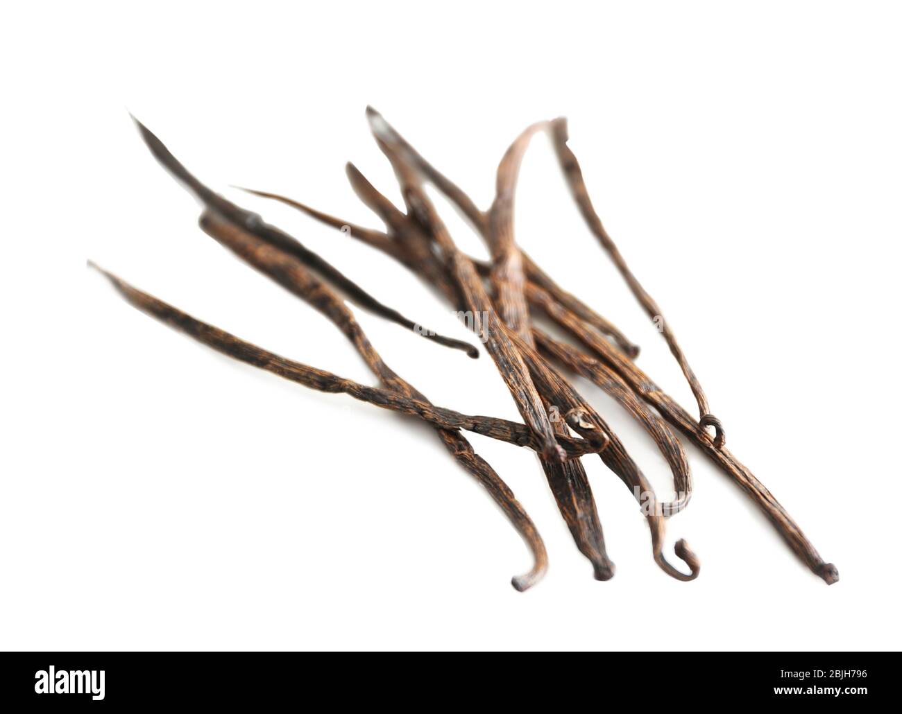 Dried vanilla sticks on white background Stock Photo - Alamy