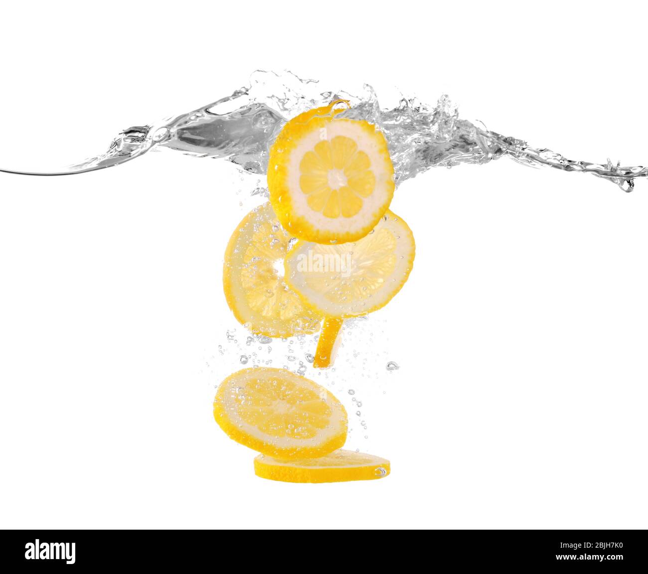 Fresh sliced lemon in water on white background Stock Photo - Alamy