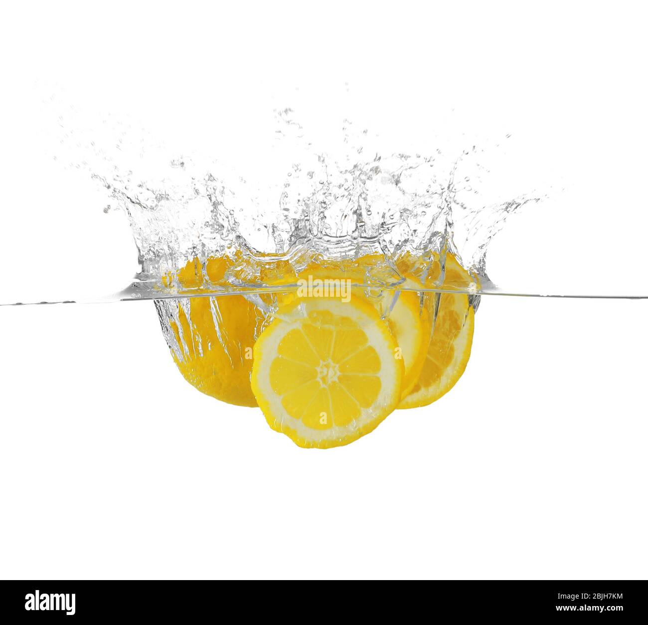 Fresh sliced lemon in water on white background Stock Photo - Alamy