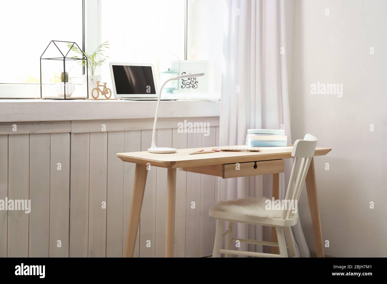 Modern comfortable workplace with laptop on window sill at home Stock ...