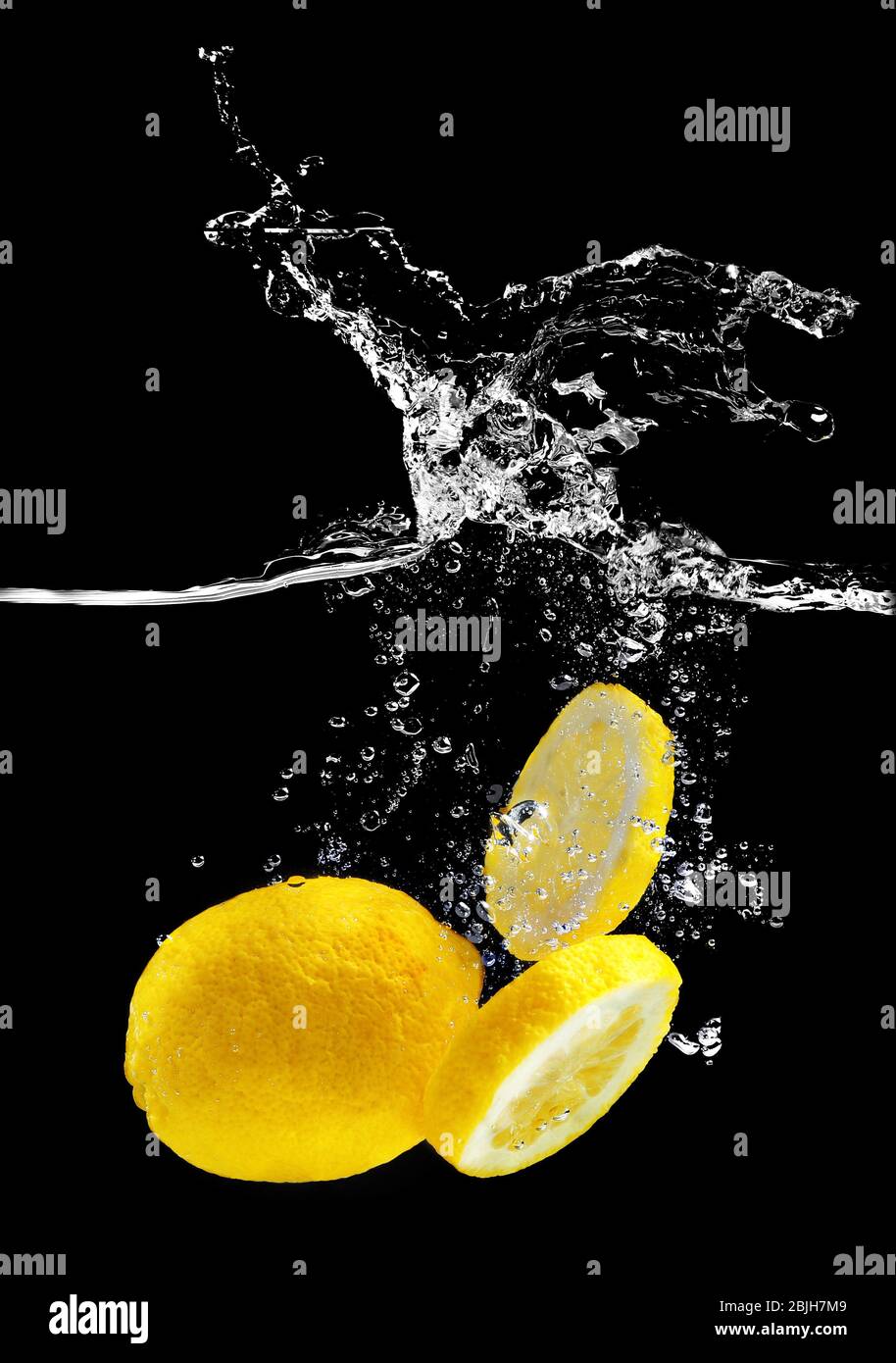 Lemon slices falling water in hi-res stock photography and images - Alamy